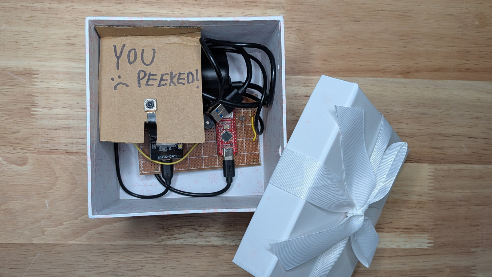 This festive ESP-32 project snitches on people who peek at their ...