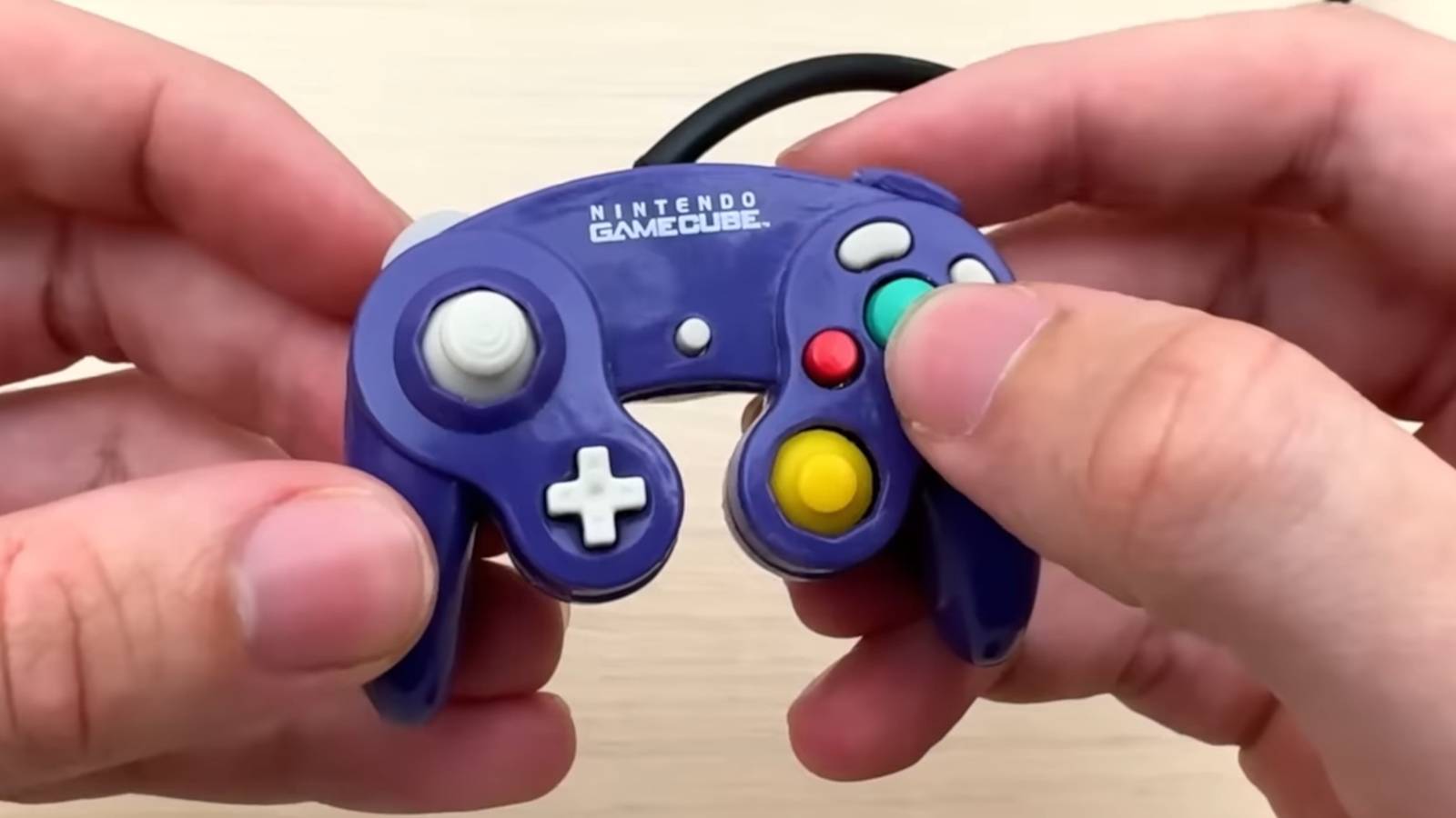 Someone turned a GameCube keychain into an actual working controller ...