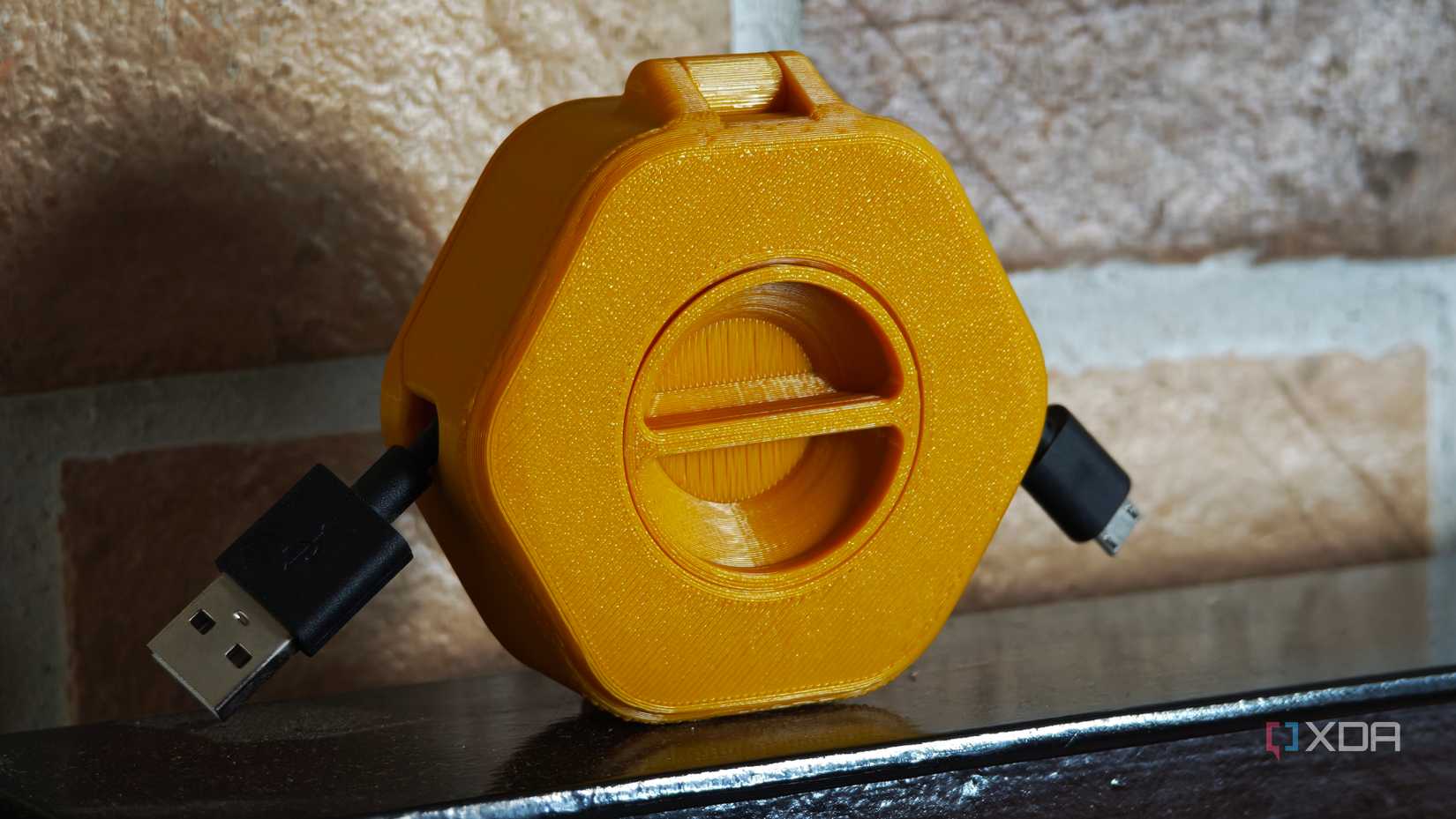 This 3D-printed cable winder reduced the cable clutter in my backpack